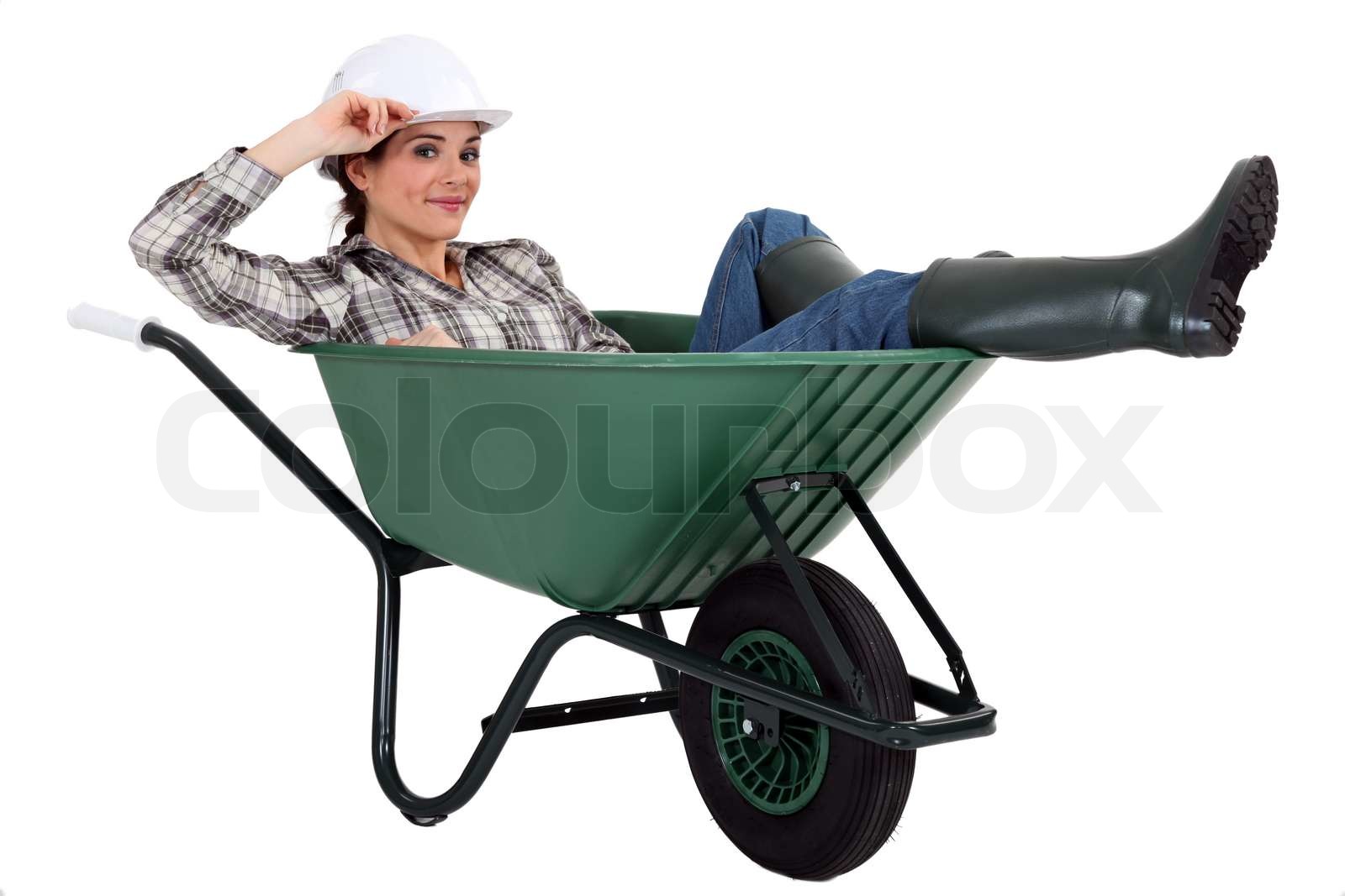 Woman in a wheelbarrow | Stock image | Colourbox