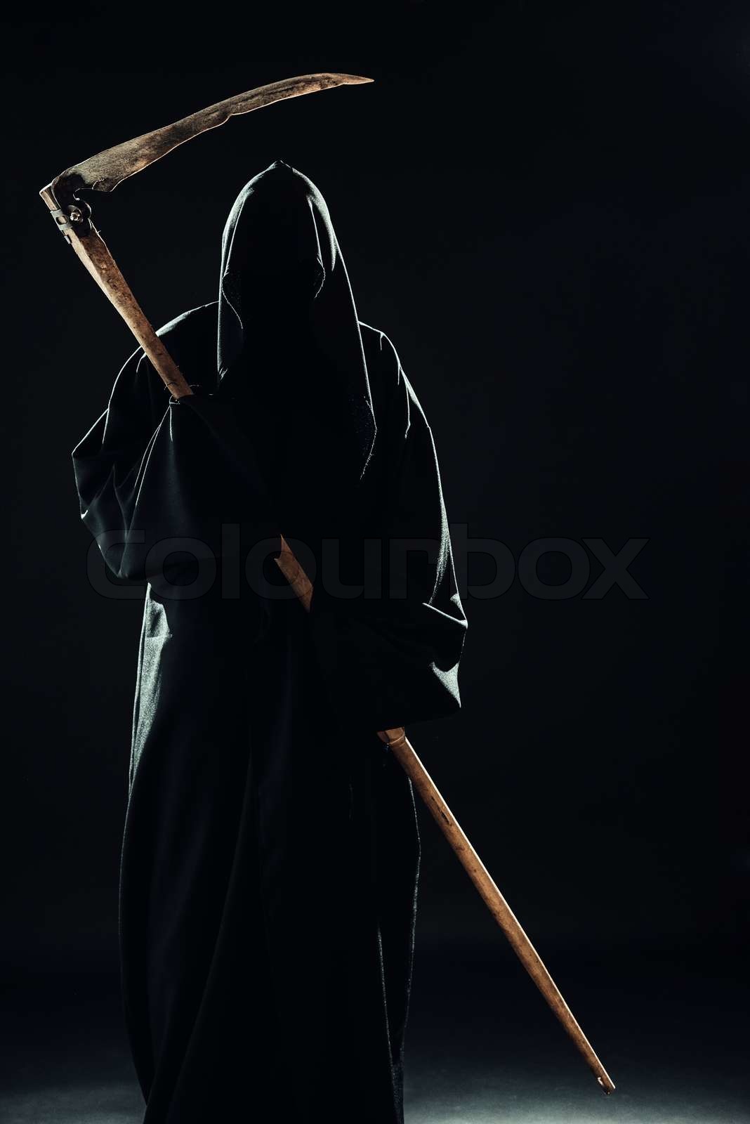 death with scythe standing in the dark | Stock image | Colourbox