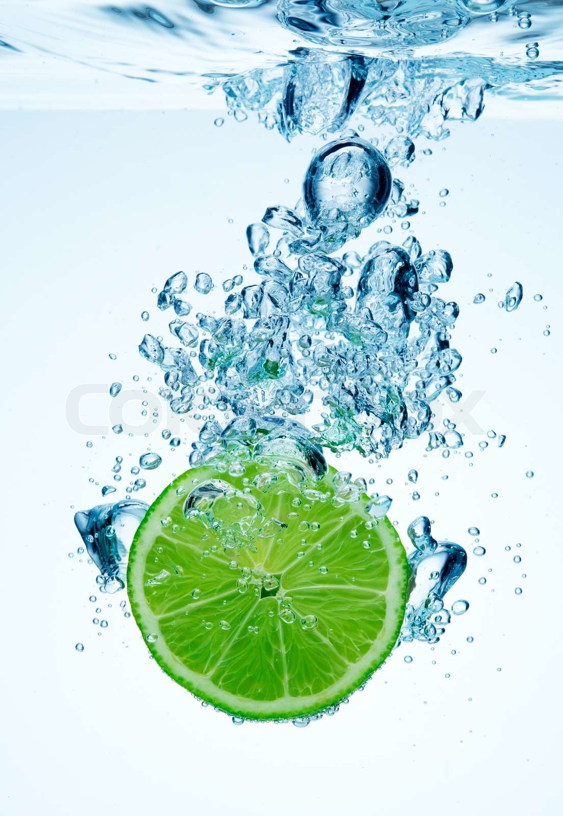 Lime dropped in a water | Stock image | Colourbox