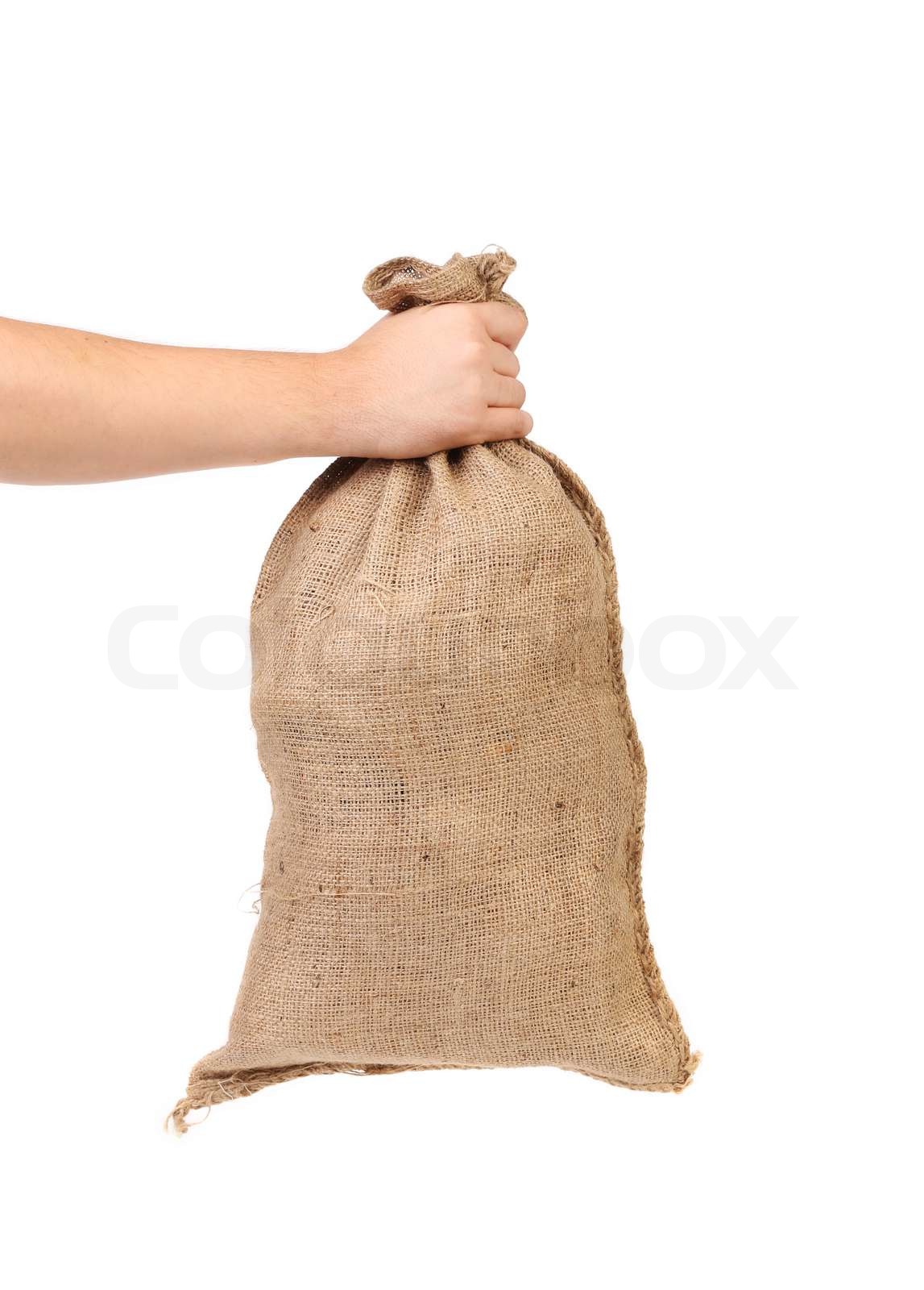Hand holding full sack | Stock image | Colourbox