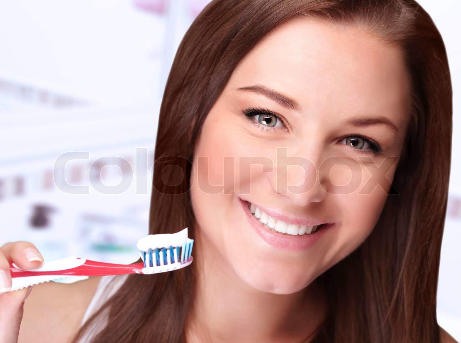 Cute girl cleaning teeth | Stock image | Colourbox