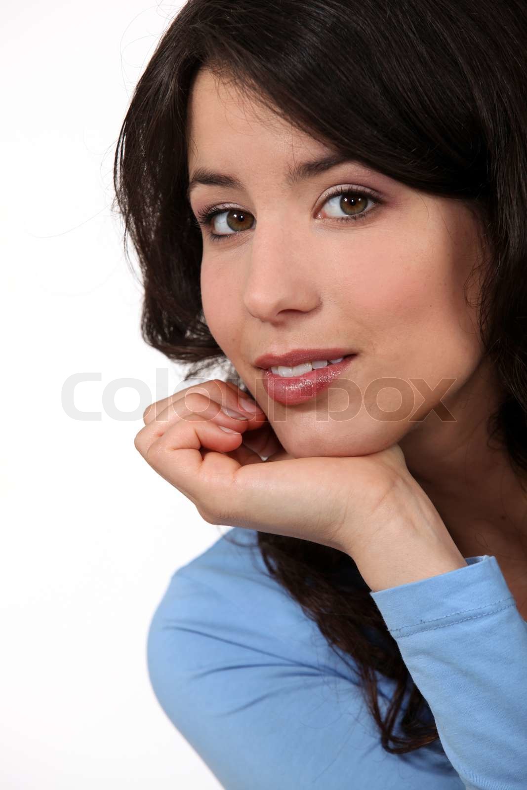 Woman resting chin on hand | Stock image | Colourbox