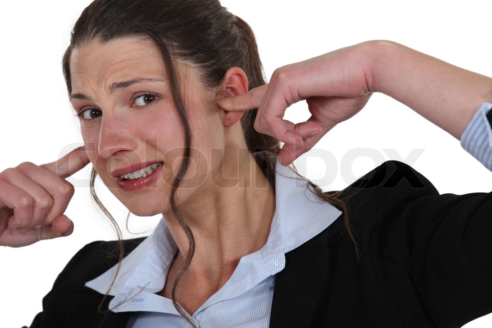 woman plugging her ears | Stock image | Colourbox
