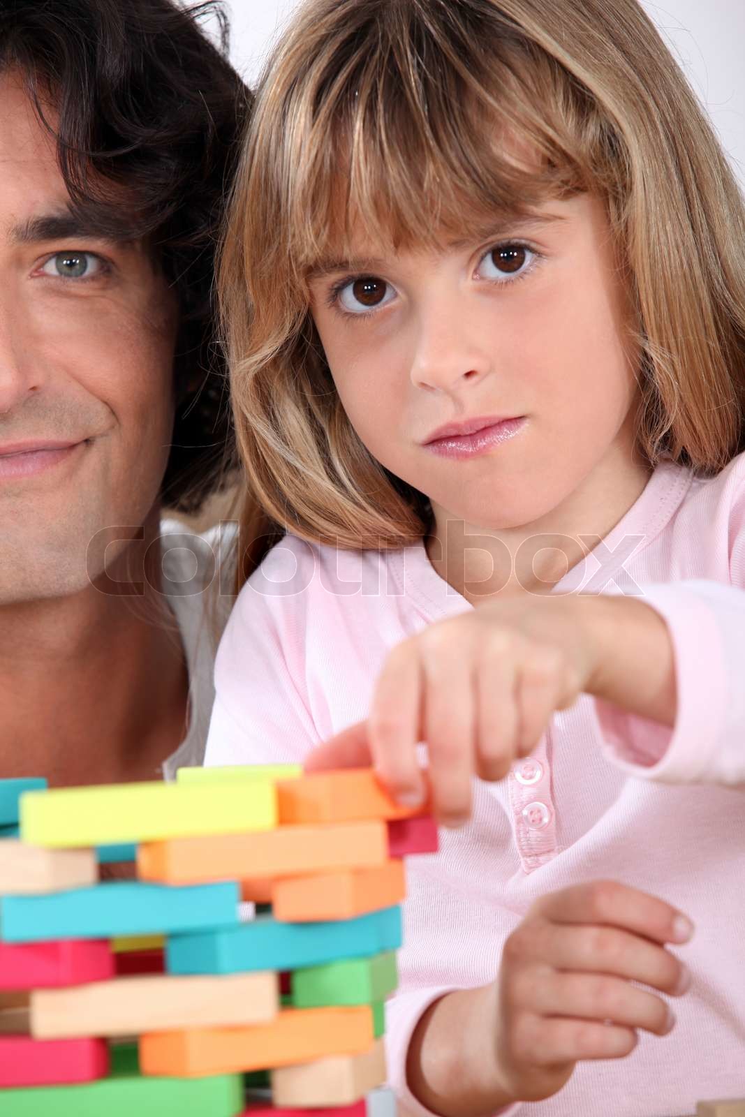 Father and daughter building a tower of blocks | Stock image | Colourbox