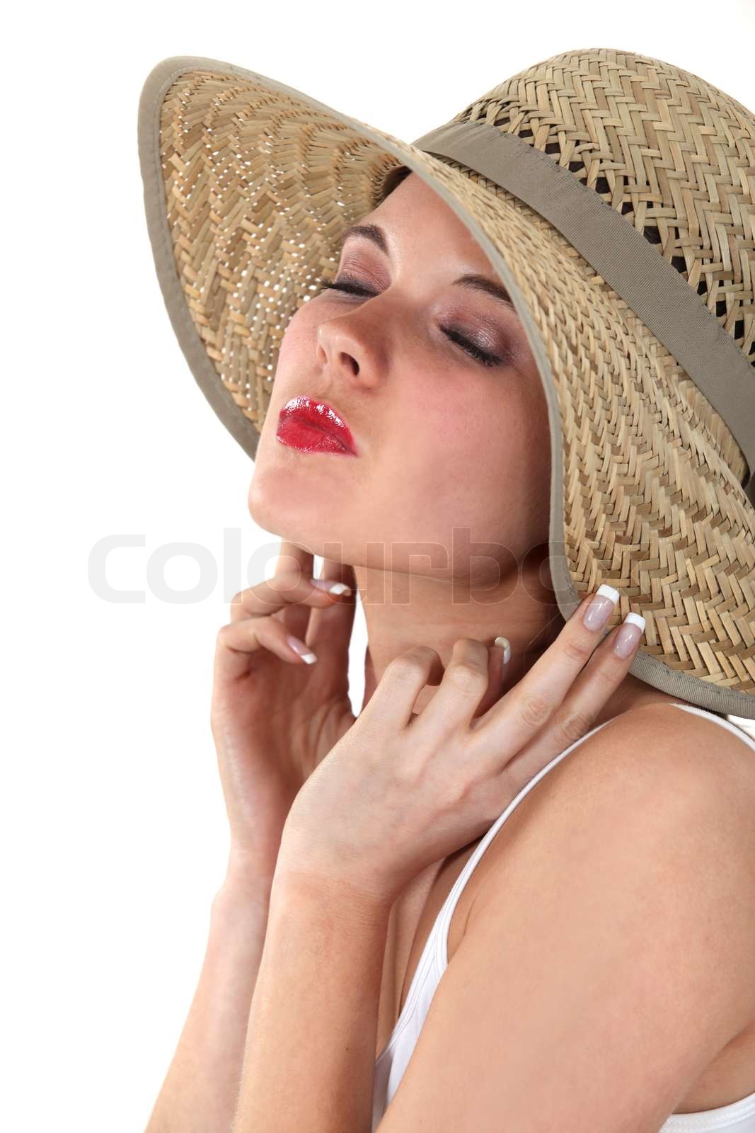 Woman wearing straw hat | Stock image | Colourbox
