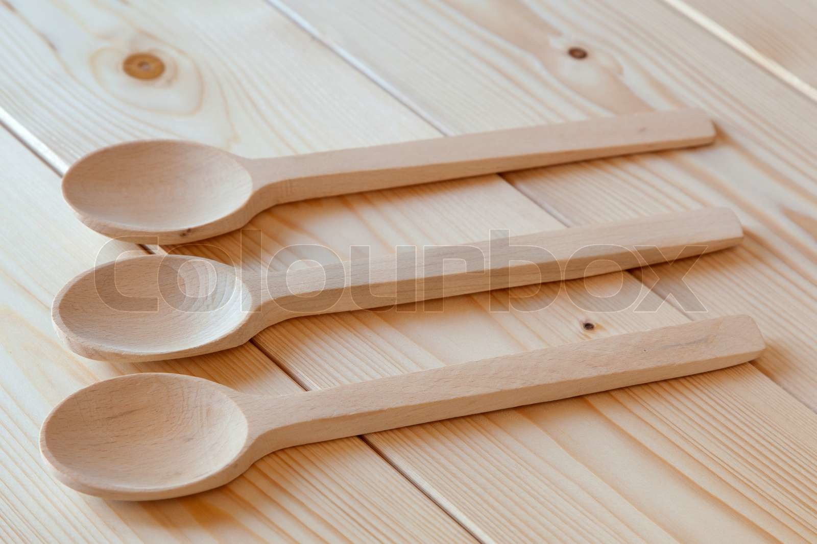 Wooden spoons on a table | Stock image | Colourbox