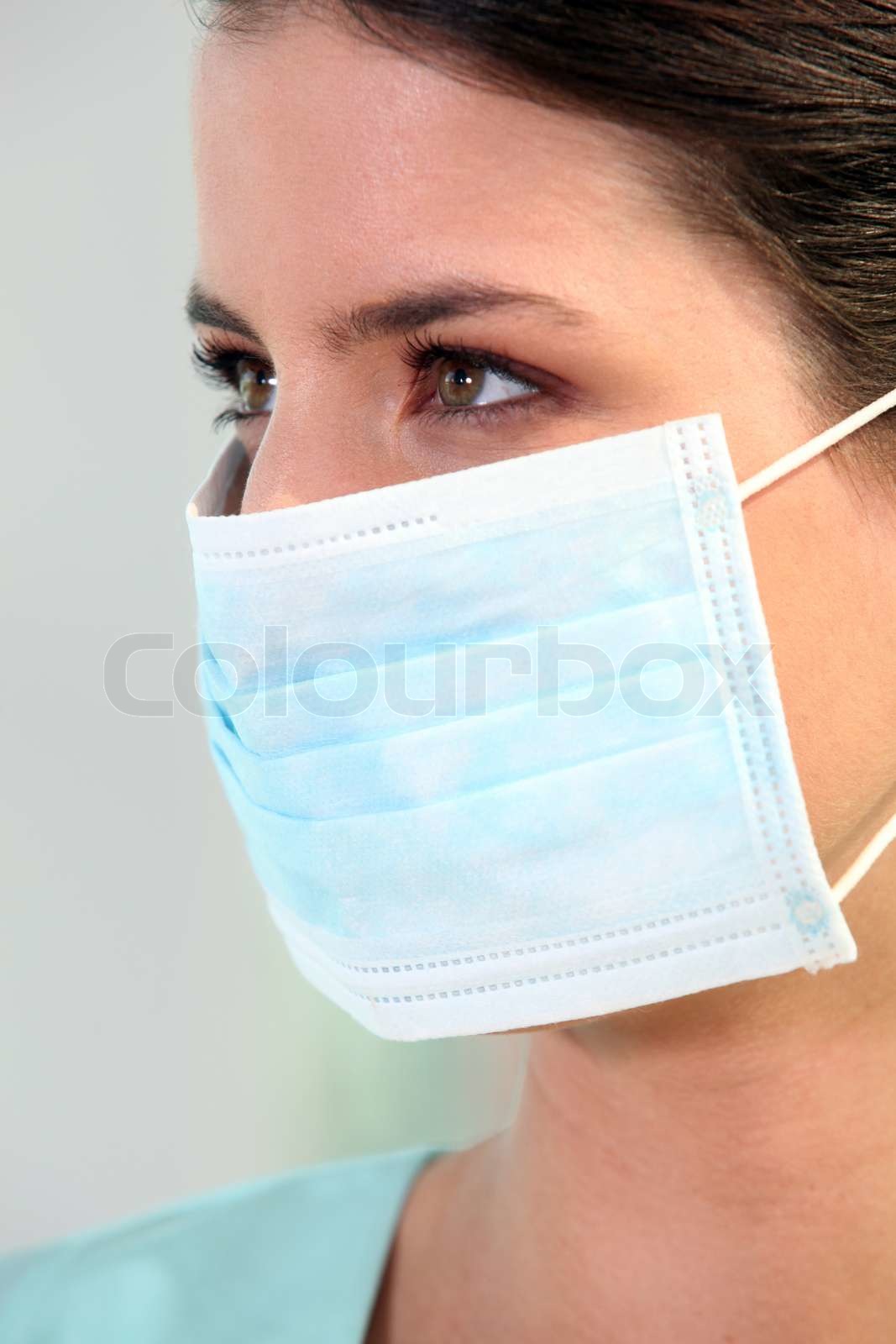 Brunette nurse wearing mask | Stock image | Colourbox