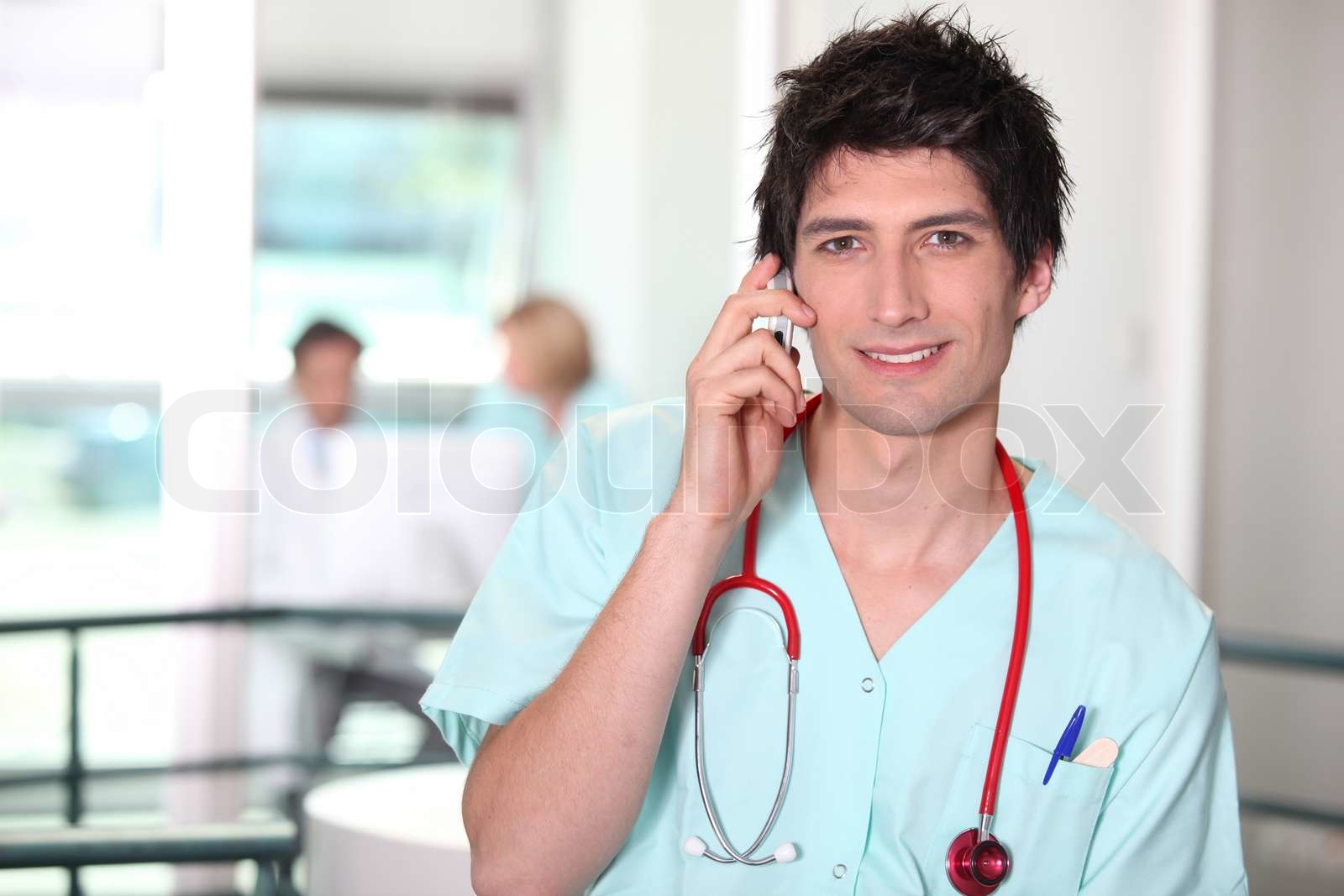 Healthcare worker talking on the phone | Stock image | Colourbox
