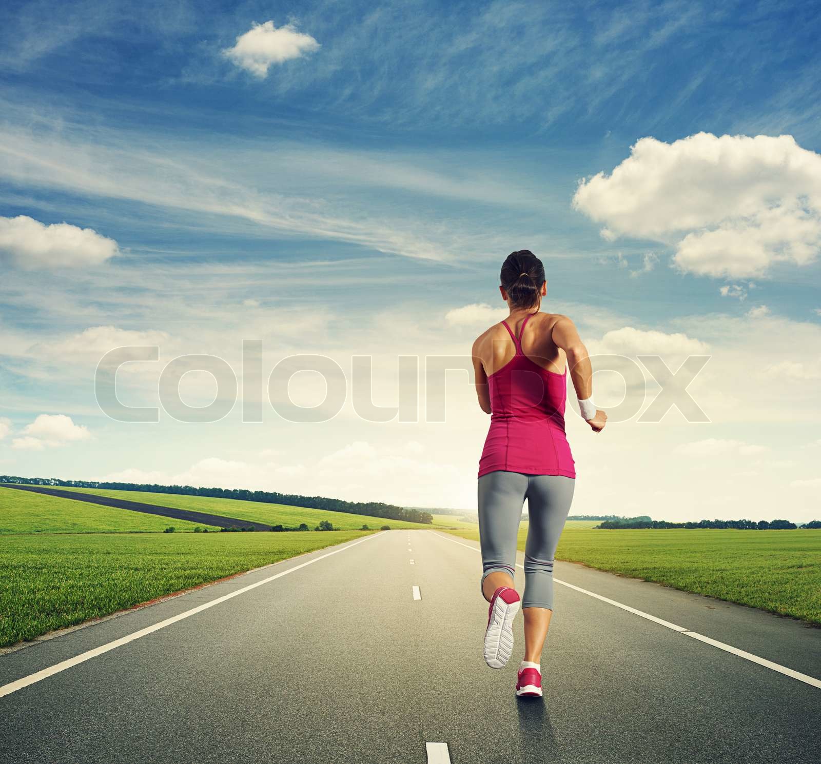 back view of running woman | Stock image | Colourbox