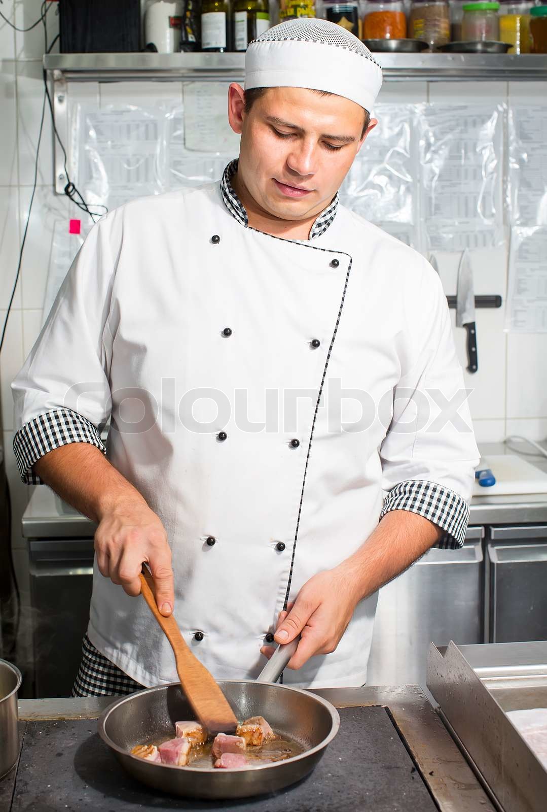 chef preparing food in the kitchen at the restaurant | Stock image ...