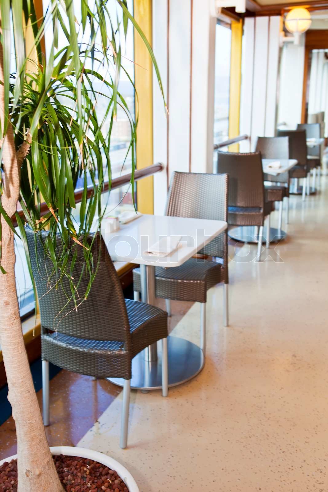Row of tables in Restaurant | Stock image | Colourbox
