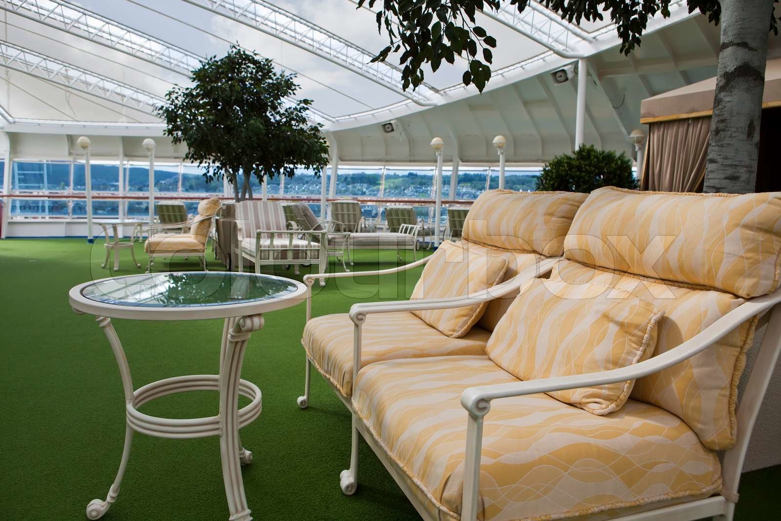 Sunbeds and sofa on open deck spa onboard of cruise ship | Stock image ...