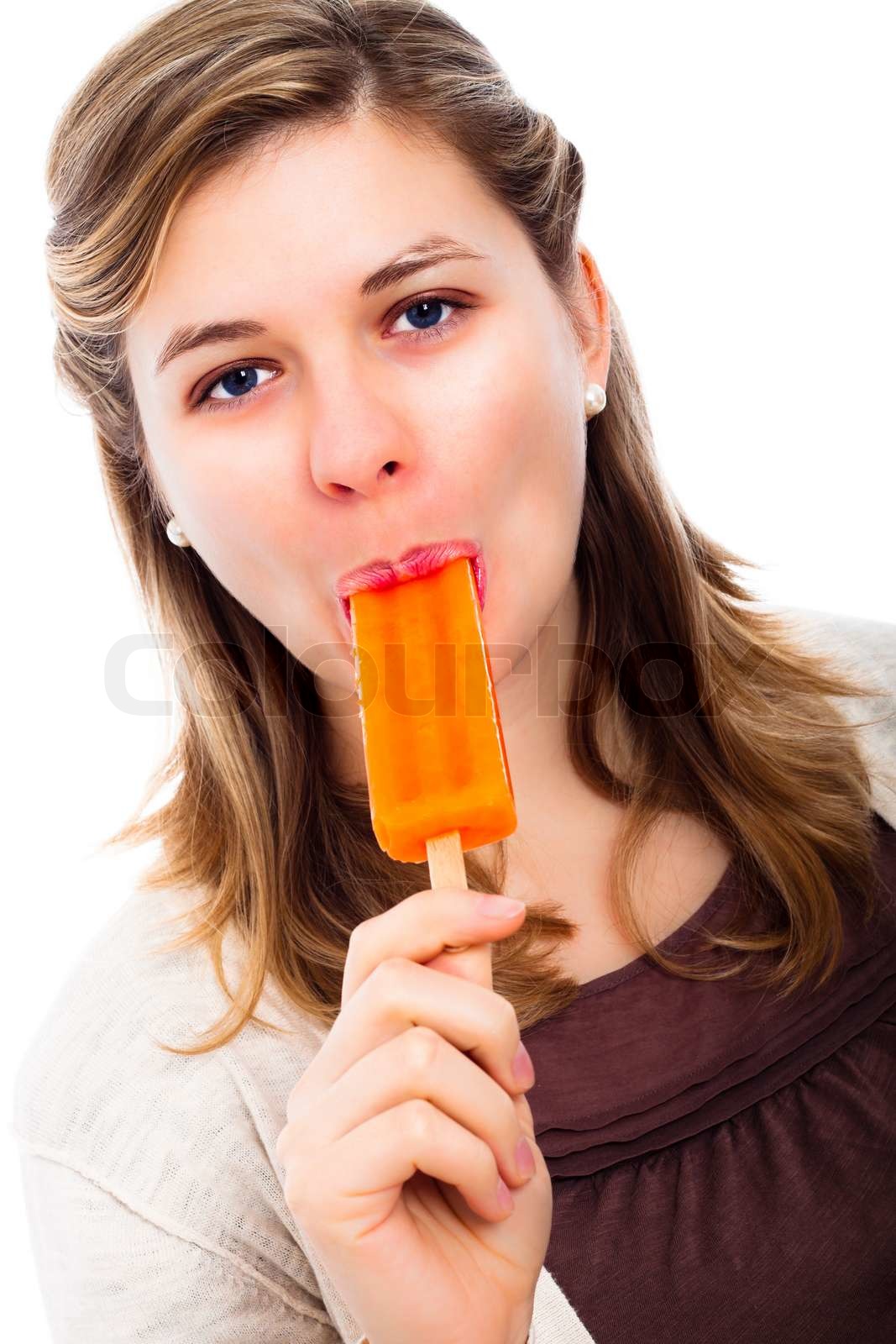 Woman eating ice lolly | Stock image | Colourbox