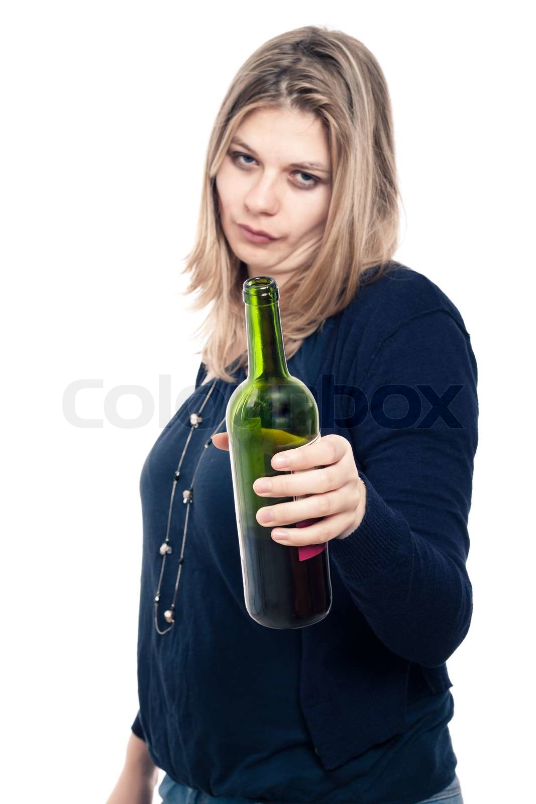 Frustriert betrunken Frau mit Flasche Wein | Stock Bild | Colourbox