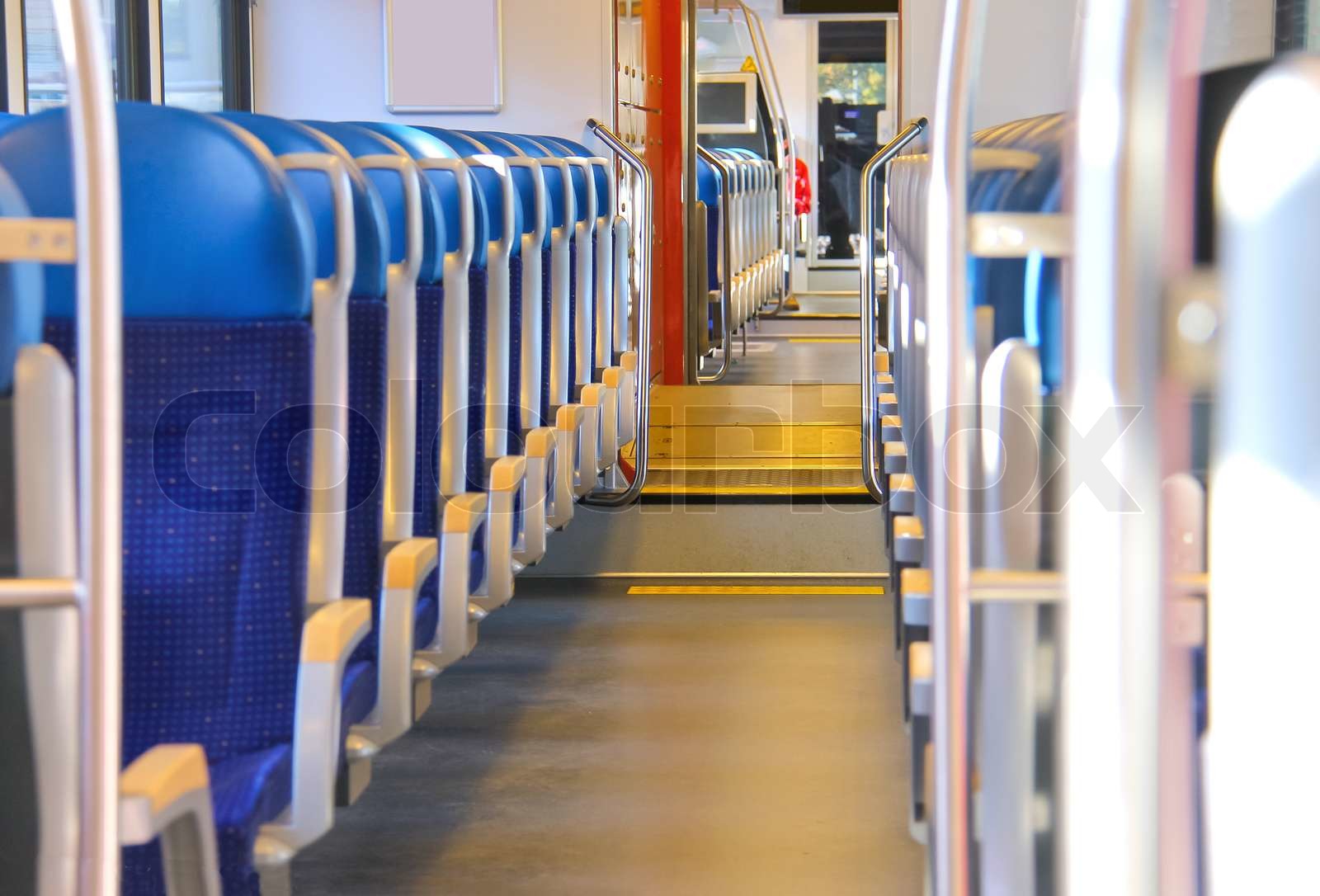 Rows of seats in a passenger train car | Stock image | Colourbox