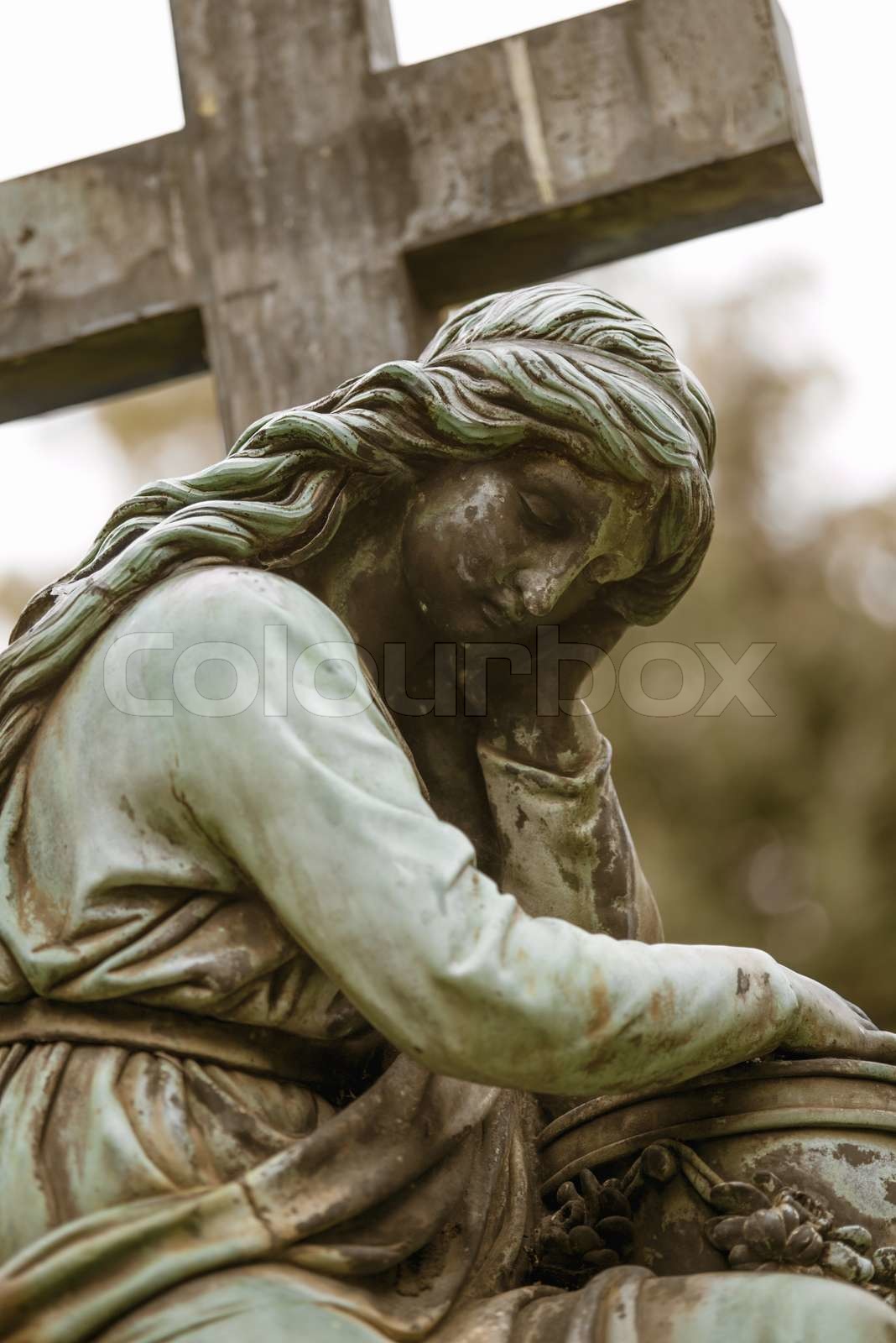 Sad woman gravestone | Stock image | Colourbox