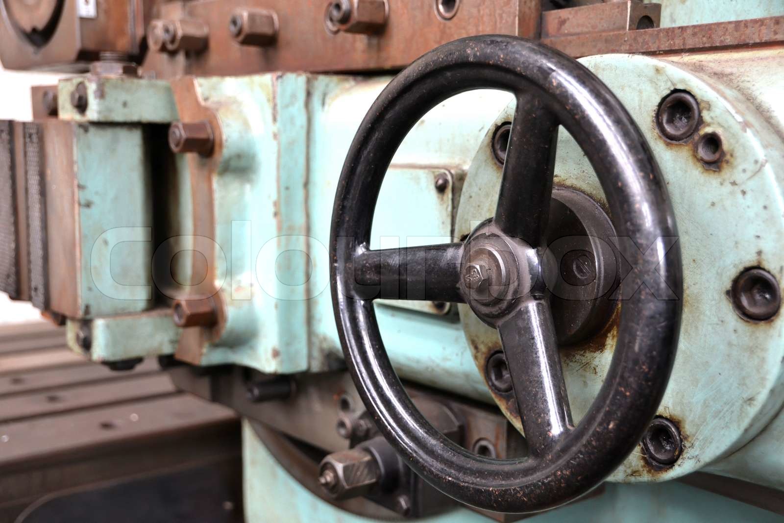 Hand wheel of an old historic lathe | Stock image | Colourbox