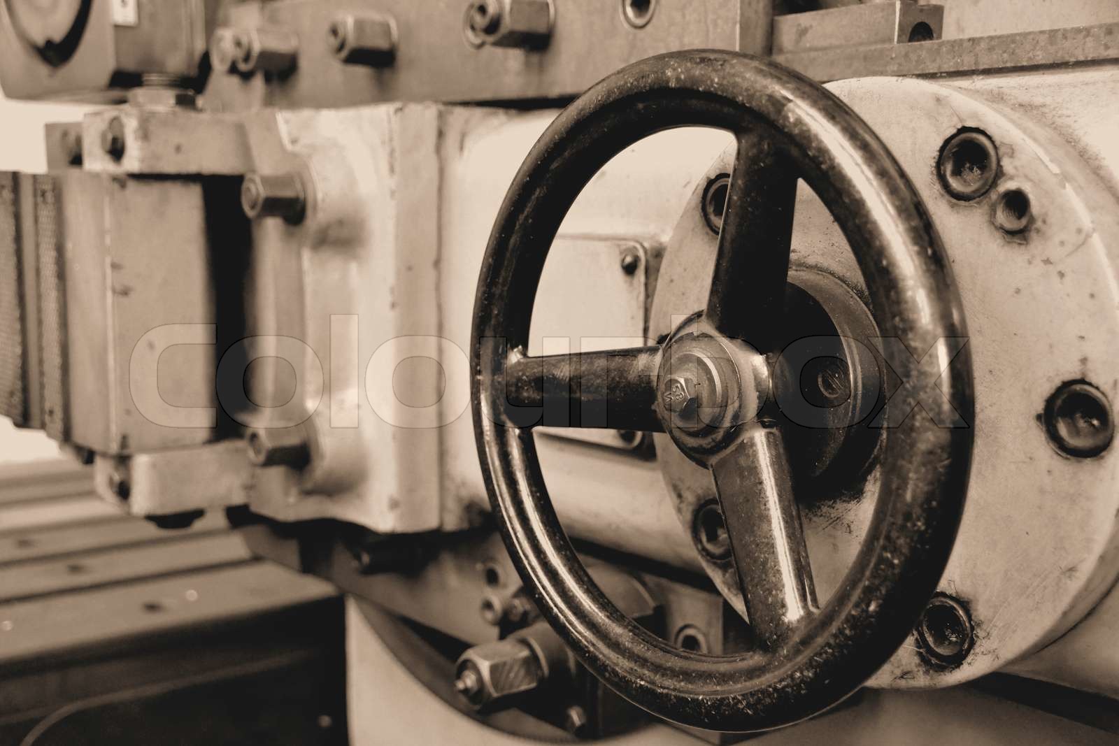 Hand wheel of an old historic lathe i | Stock image | Colourbox