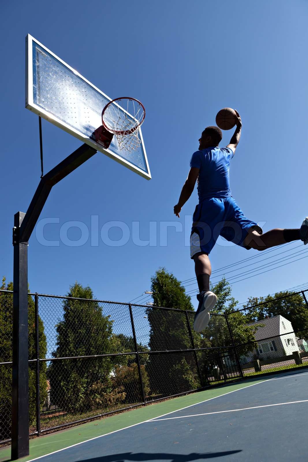 Man Dunking the Basketball | Stock image | Colourbox