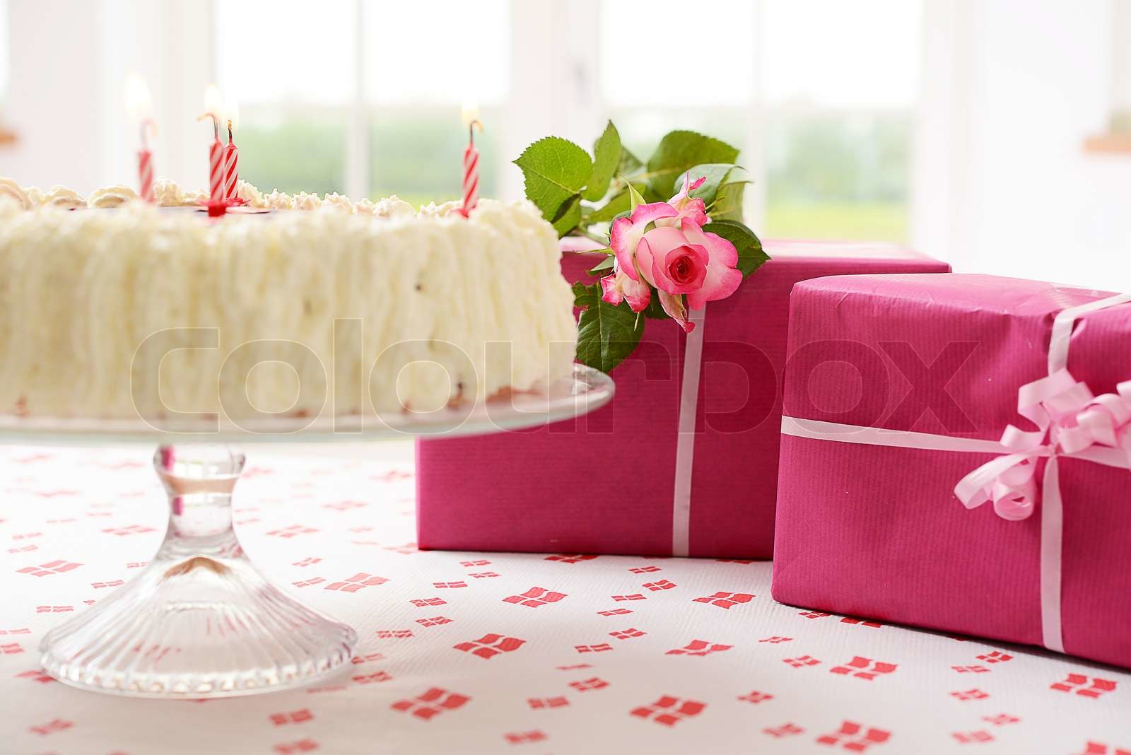 Birthday cake and presents on a table with Danish flags | Stock image ...