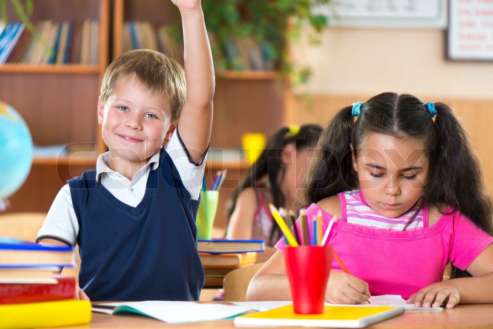 Schoolchildren during lesson in classroom at school | Stock image ...