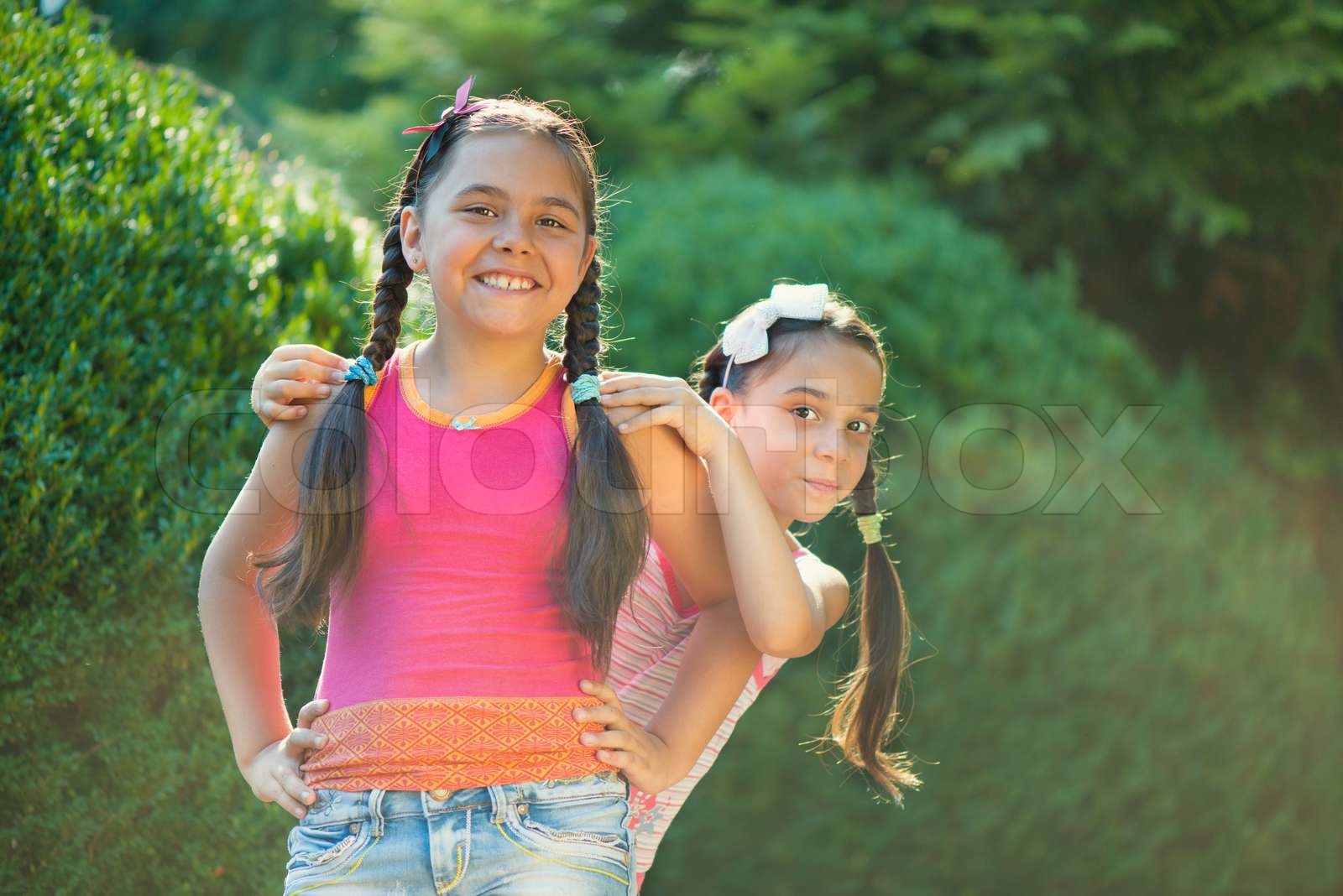 Image of two happy sisters having fun | Stock image | Colourbox