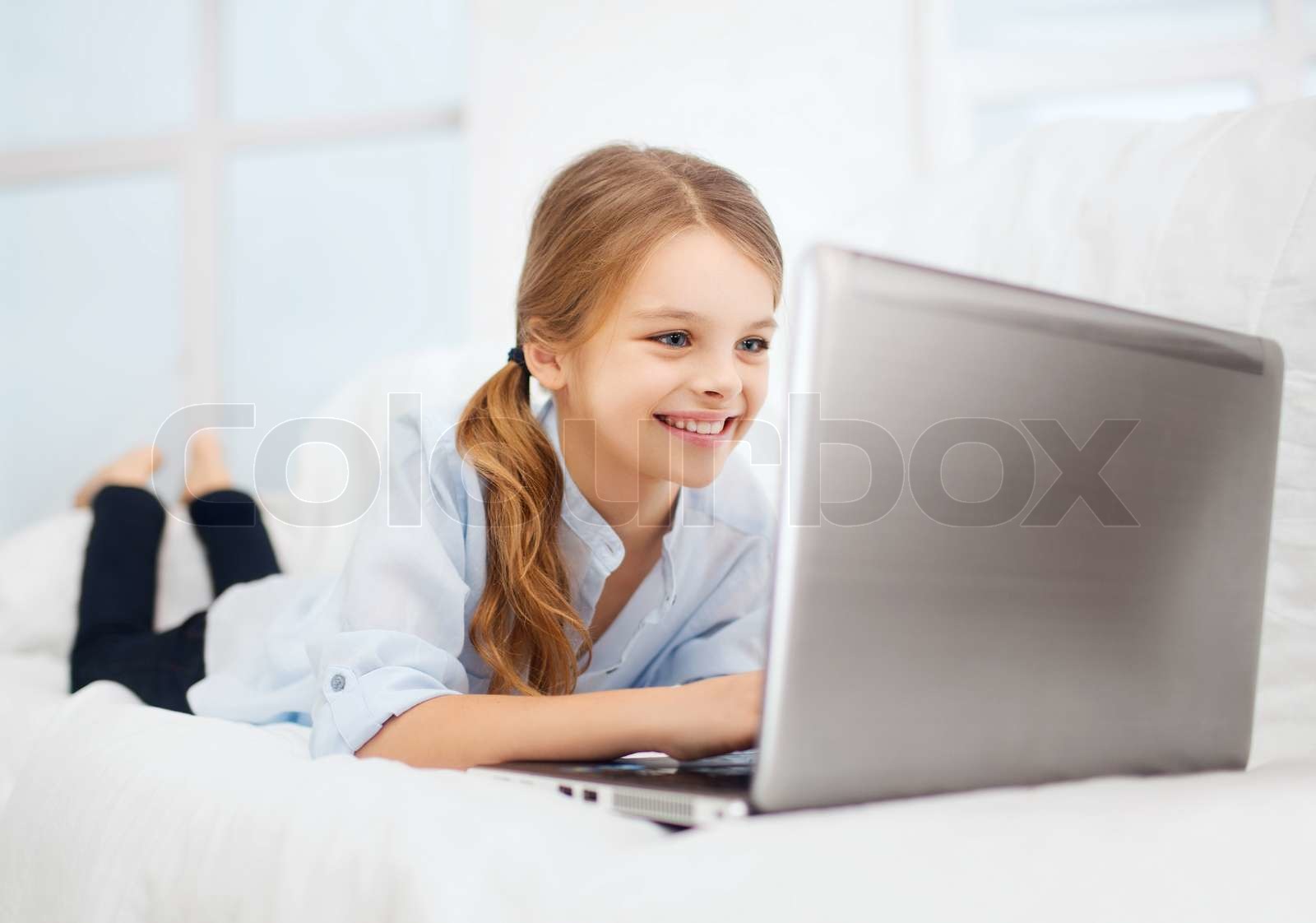 girl with laptop pc at home | Stock image | Colourbox