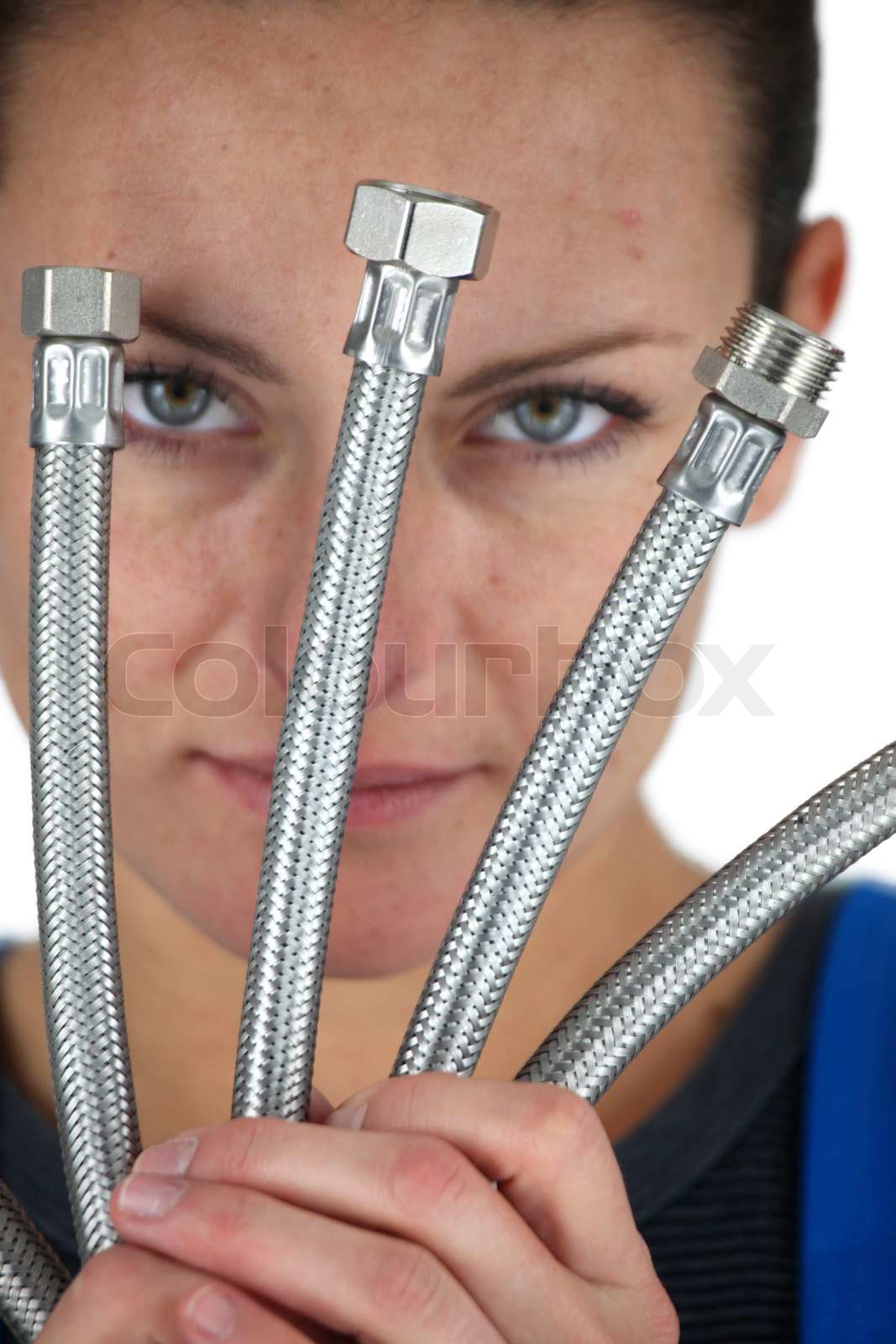 Woman holding up water pipes | Stock image | Colourbox