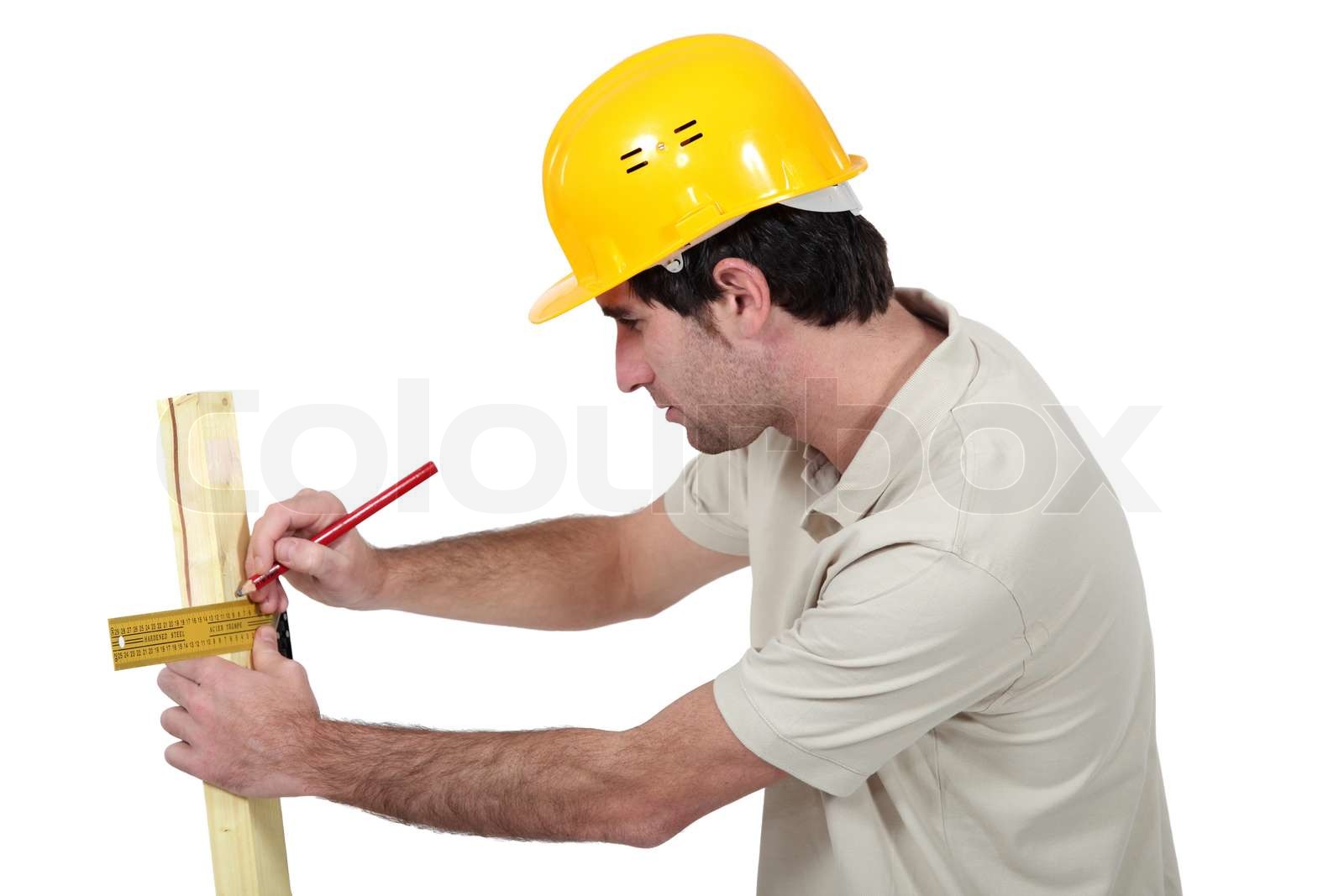 Man marking wood with setsquare | Stock image | Colourbox