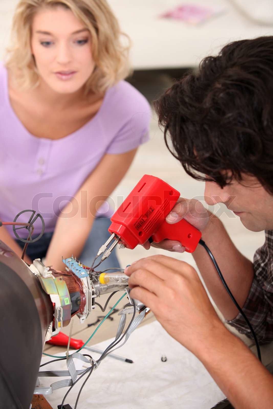 repairman repairing a television | Stock image | Colourbox