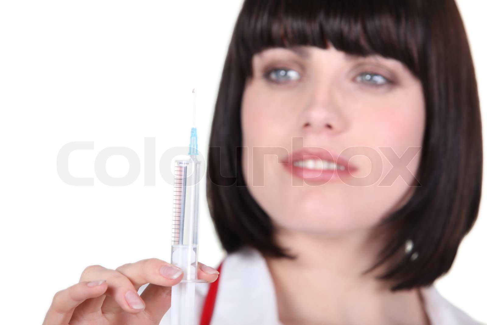 Nurse preparing an injection | Stock image | Colourbox
