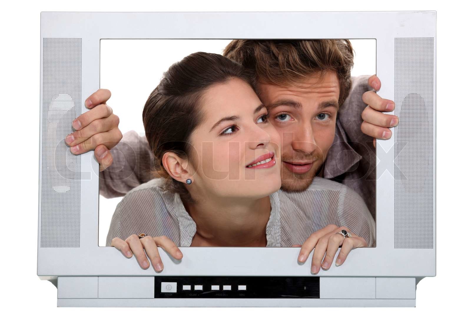 Couple inside a television set | Stock image | Colourbox