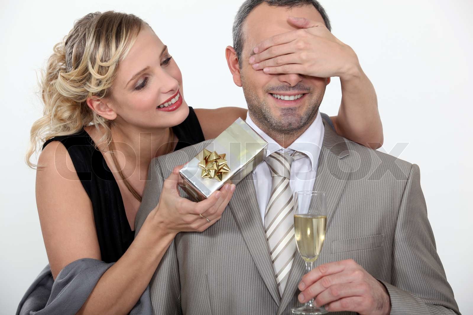 a wife making a surprise to her husband | Stock image | Colourbox