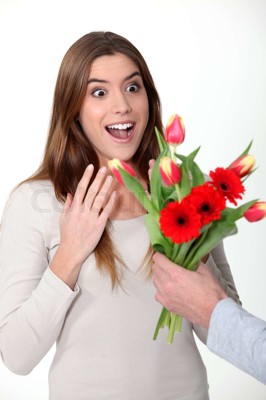 Woman receiving bouquet of flowers | Stock image | Colourbox