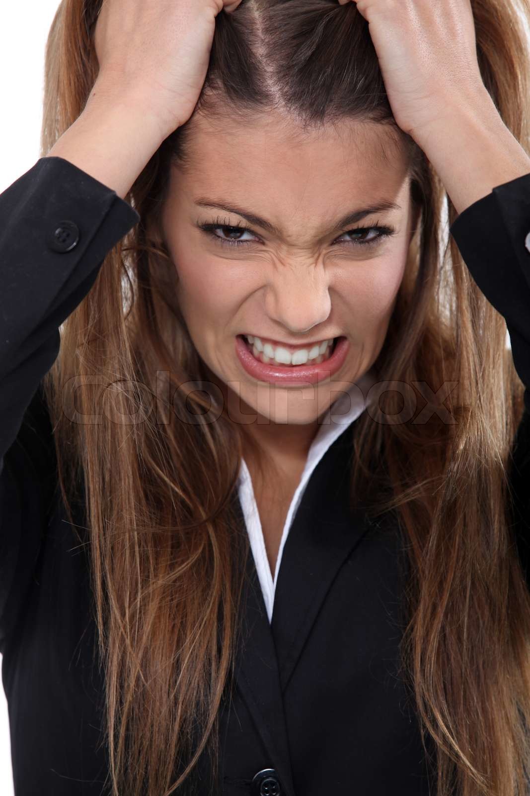 Businesswoman pulling hair out | Stock image | Colourbox