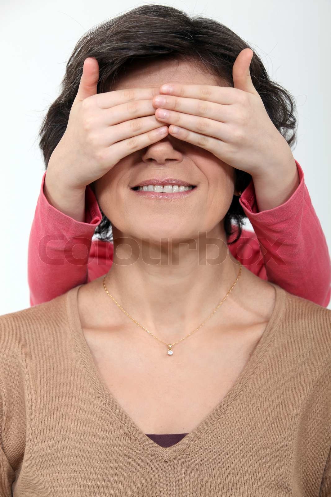 Daughter covering mother's face | Stock image | Colourbox