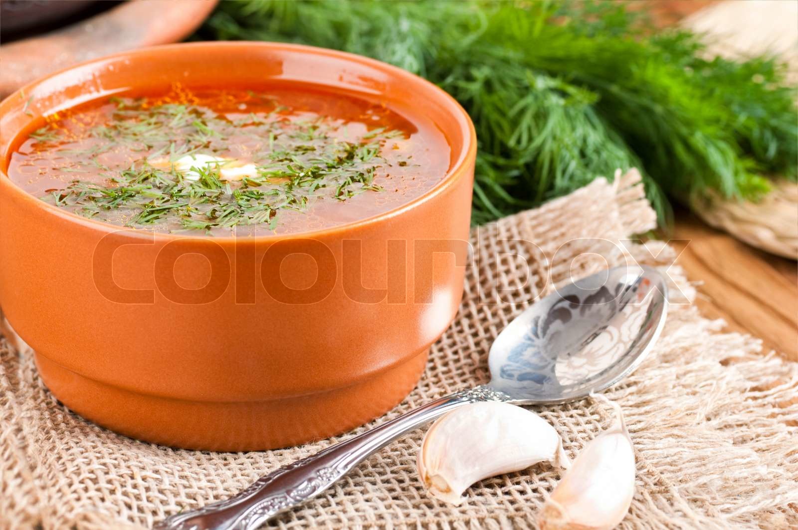 Borsch, soup from a beet and cabbage with tomato sauce An onion with ...