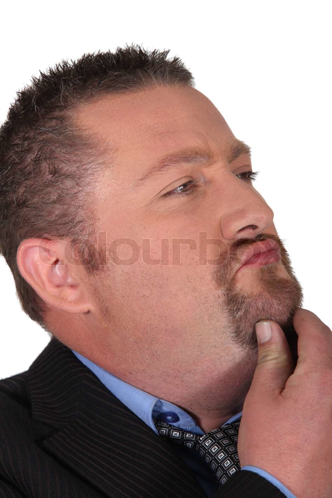 Man scratching his chin | Stock image | Colourbox