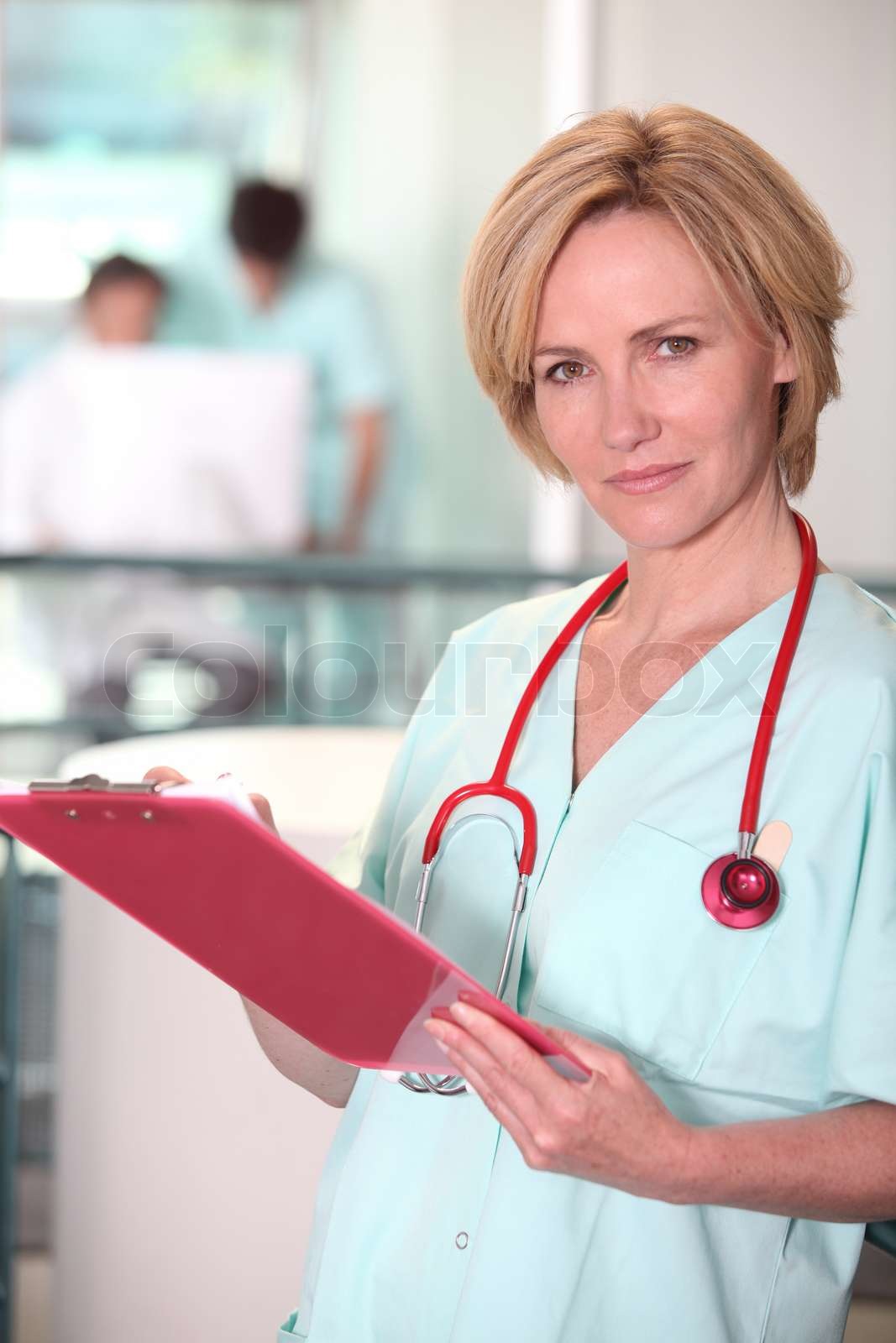 Blond nurse at work | Stock image | Colourbox