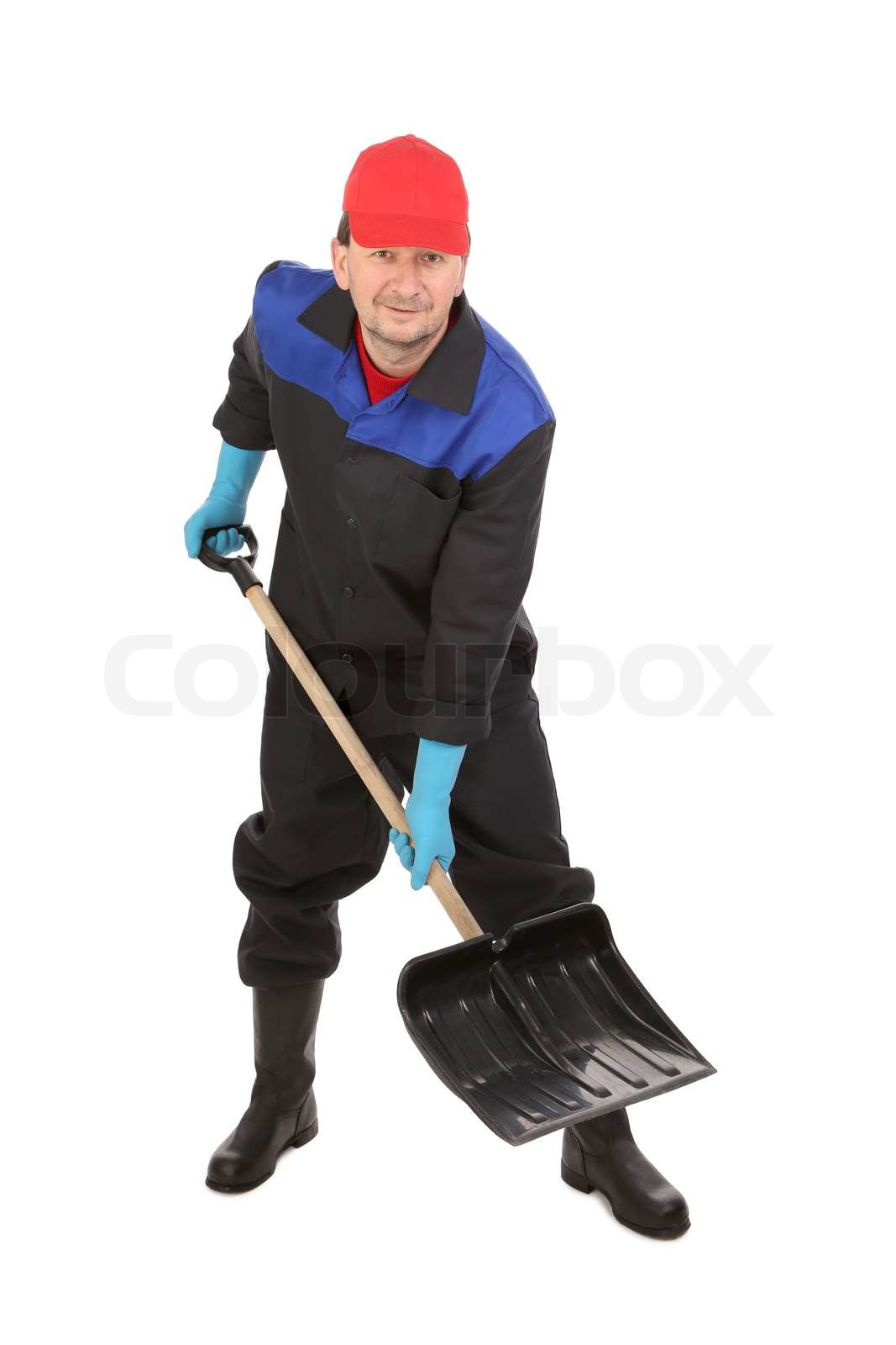 Man holds black shovel | Stock image | Colourbox