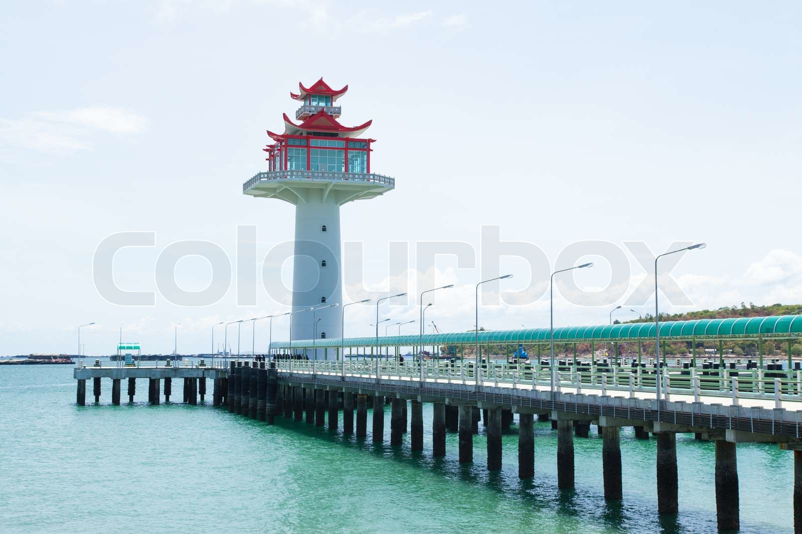 Lighthouse bridge stretching into the sea | Stock image | Colourbox