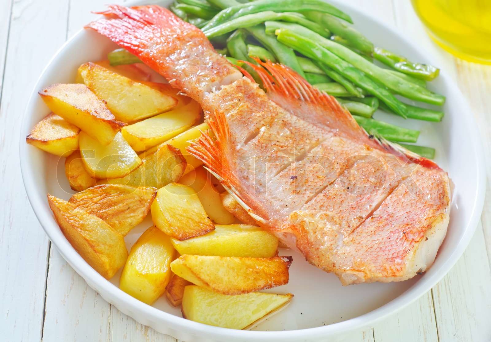 baked fish with potato and green beans | Stock image | Colourbox