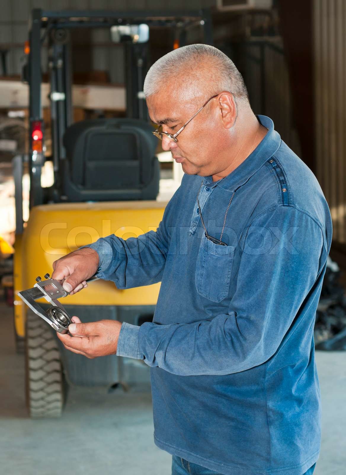The tool in hands | Stock image | Colourbox