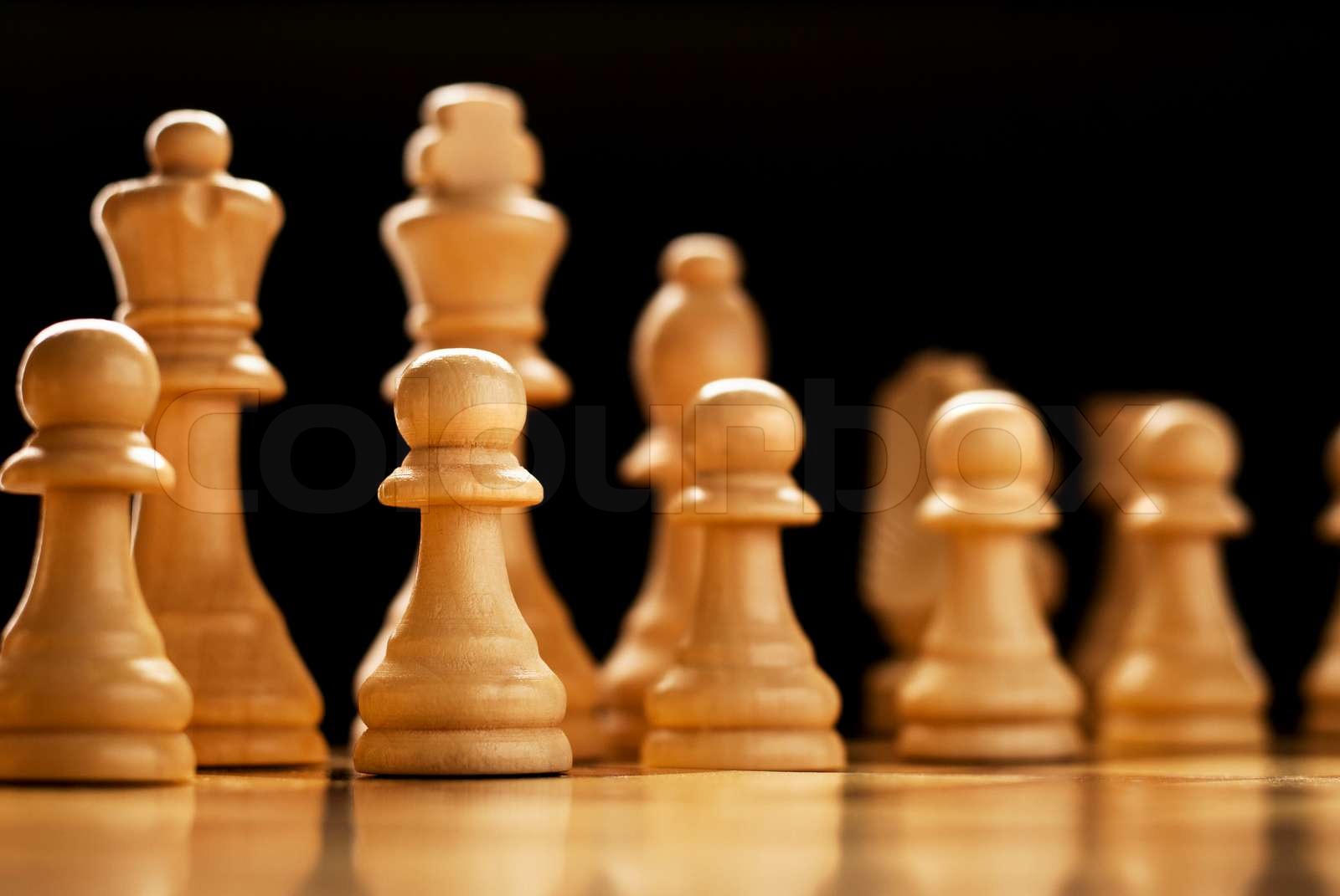 Chess pieces lined up on a chess board | Stock image | Colourbox