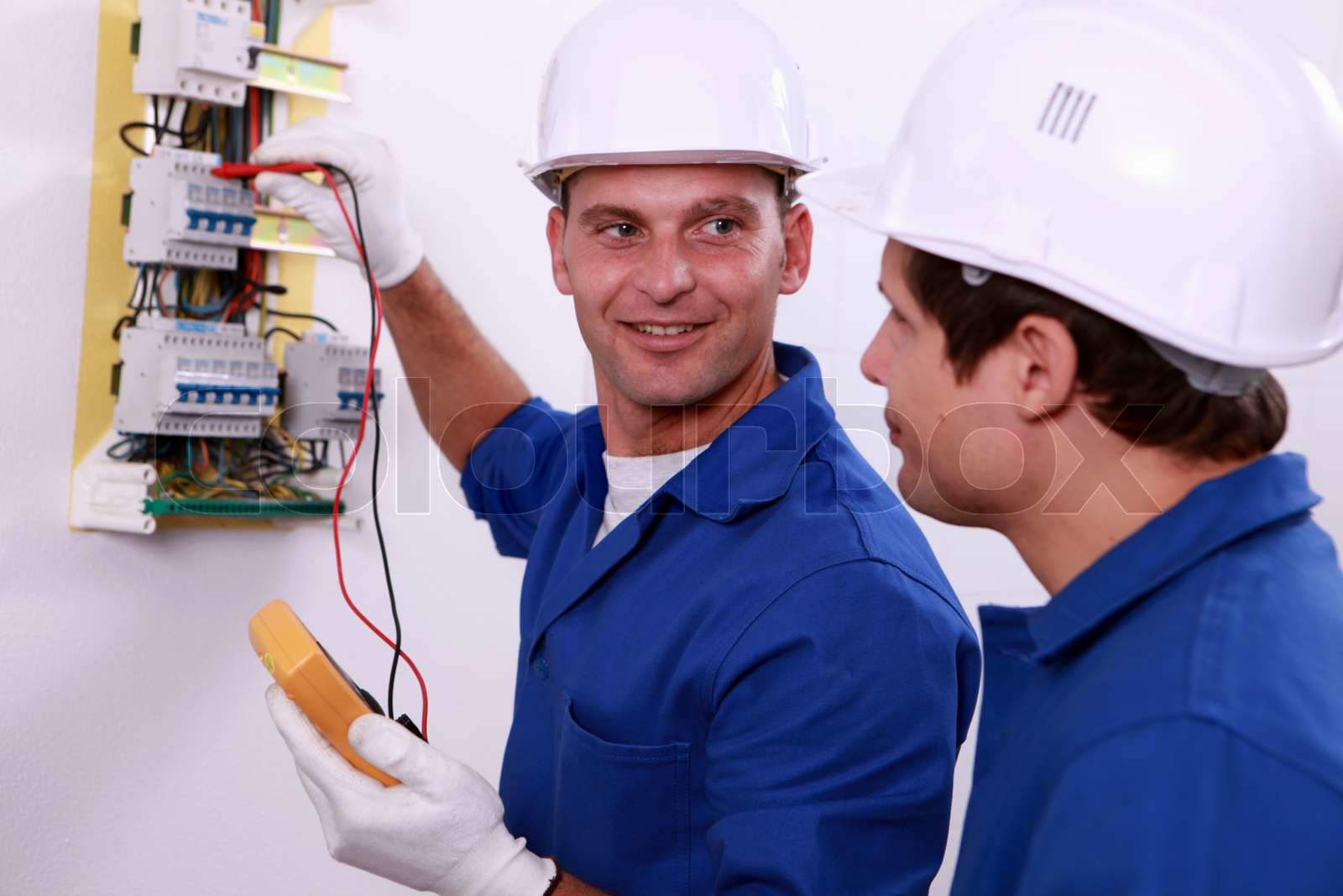 Electrical safety inspectors verifying central fuse box | Stock image ...