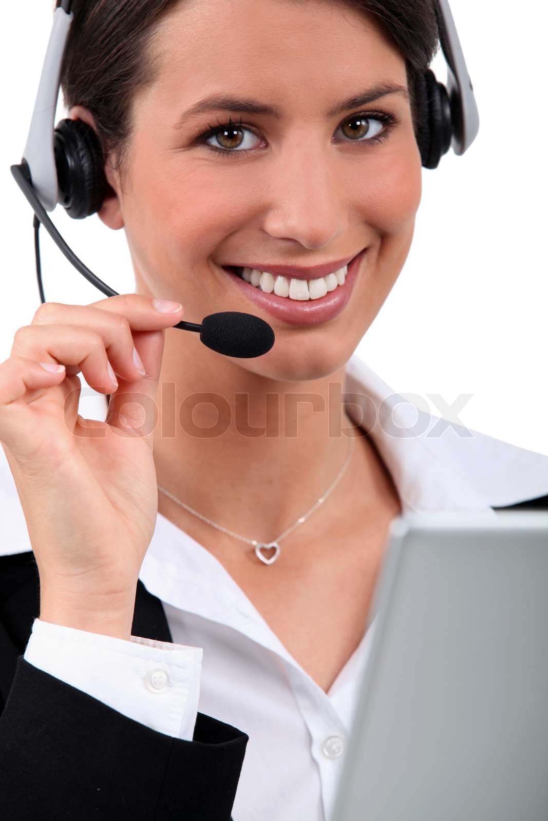 Woman with a headset and laptop | Stock image | Colourbox