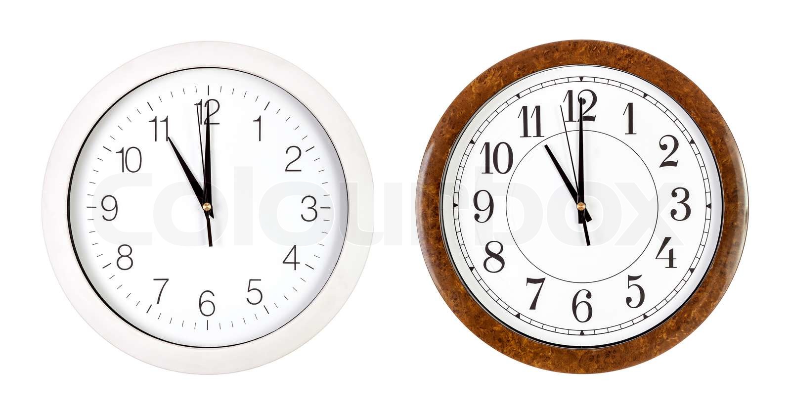 Two clock faces showing eleven o'clock | Stock image | Colourbox