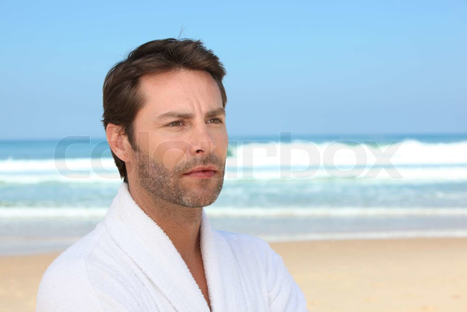 Man standing on the beach | Stock image | Colourbox