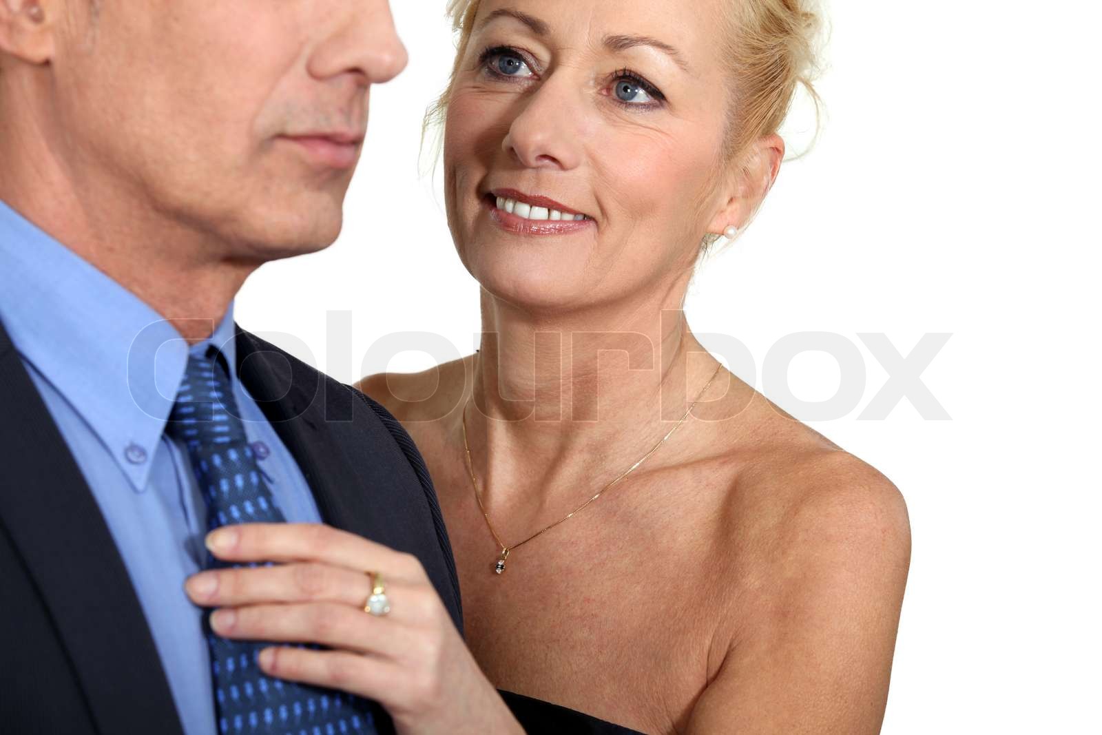 Wife helping husband with tie | Stock image | Colourbox