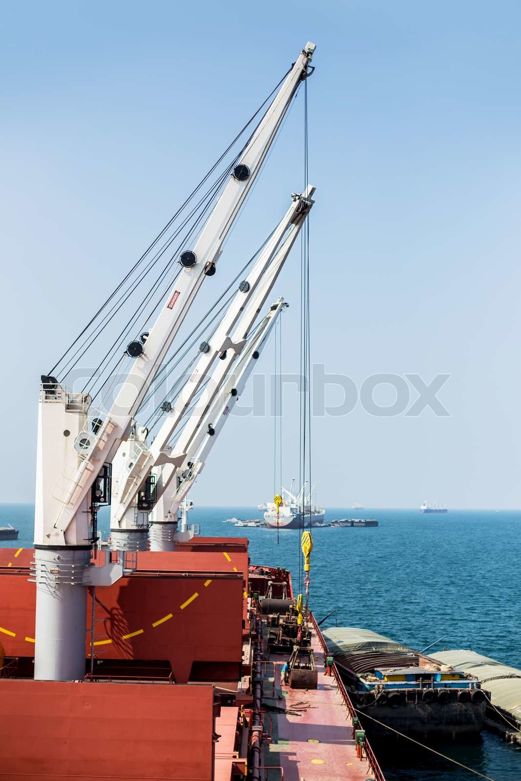 Lifting cranes on barges | Stock image | Colourbox
